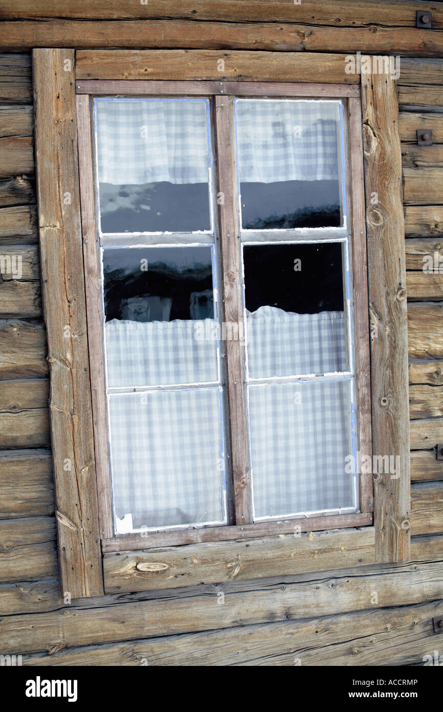 A window on a log house Stock Photo - Alamy