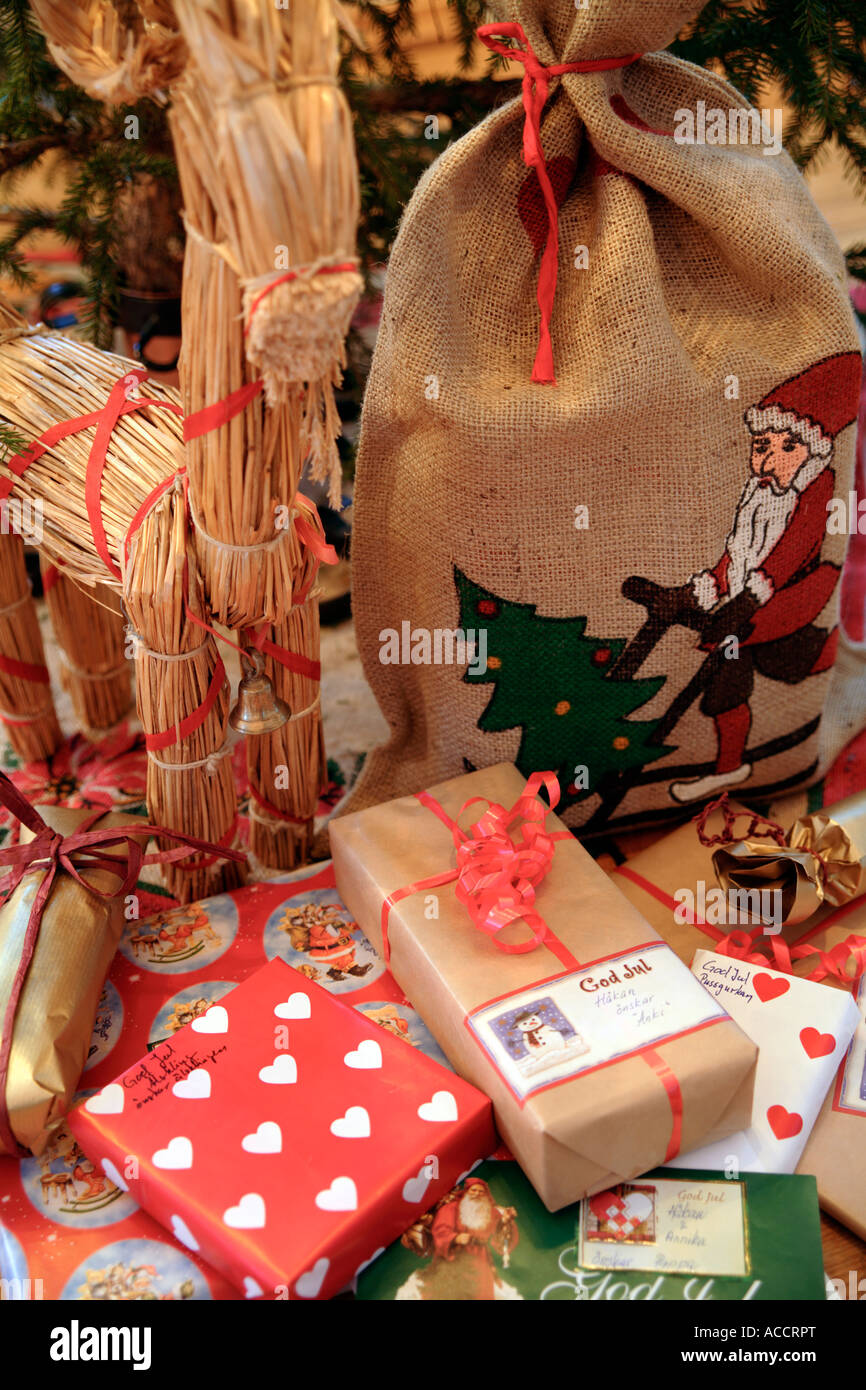 A Christmas goat and Christmas presents Stock Photo - Alamy