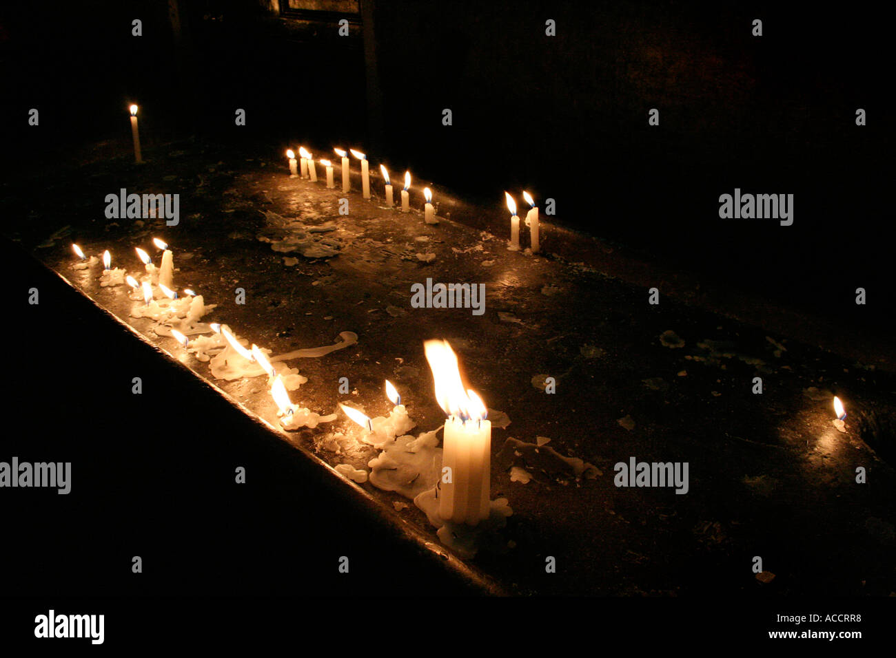 candles in the crypt of the Basilica of Our Lady of Copacabana, Lake ...