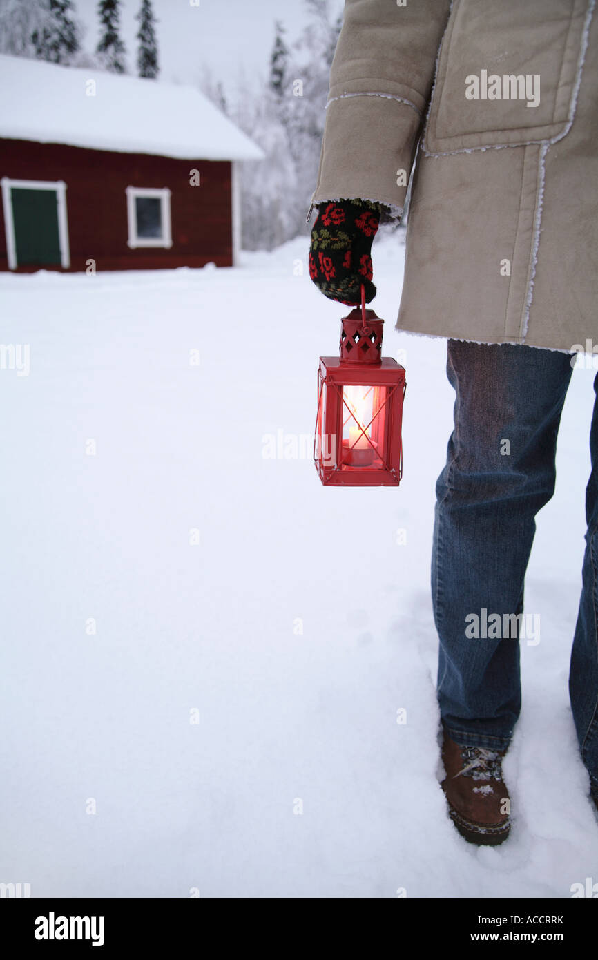 A person carrying a lantern Stock Photo - Alamy