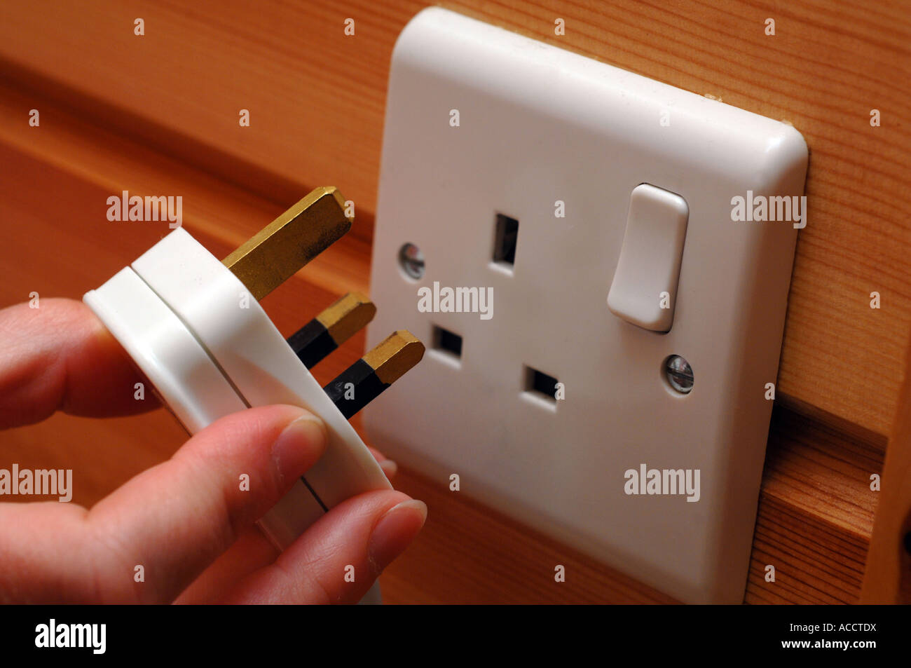 Plug and socket, three pin plug Stock Photo - Alamy