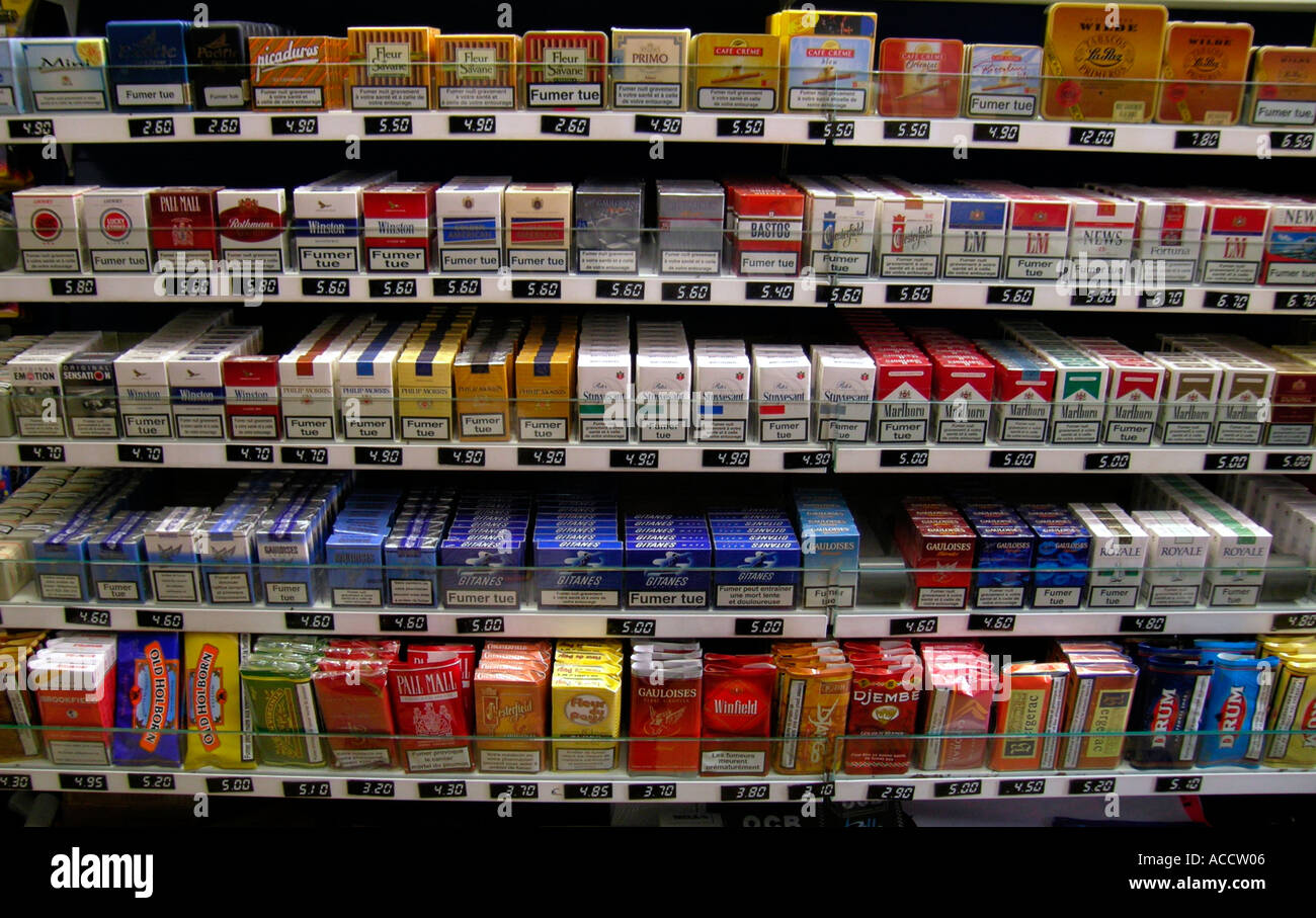 shelves with cigarette packets with health warnings in a tabacco shop ... shelves with cigarette packets with health warnings in a tabacco shop ...