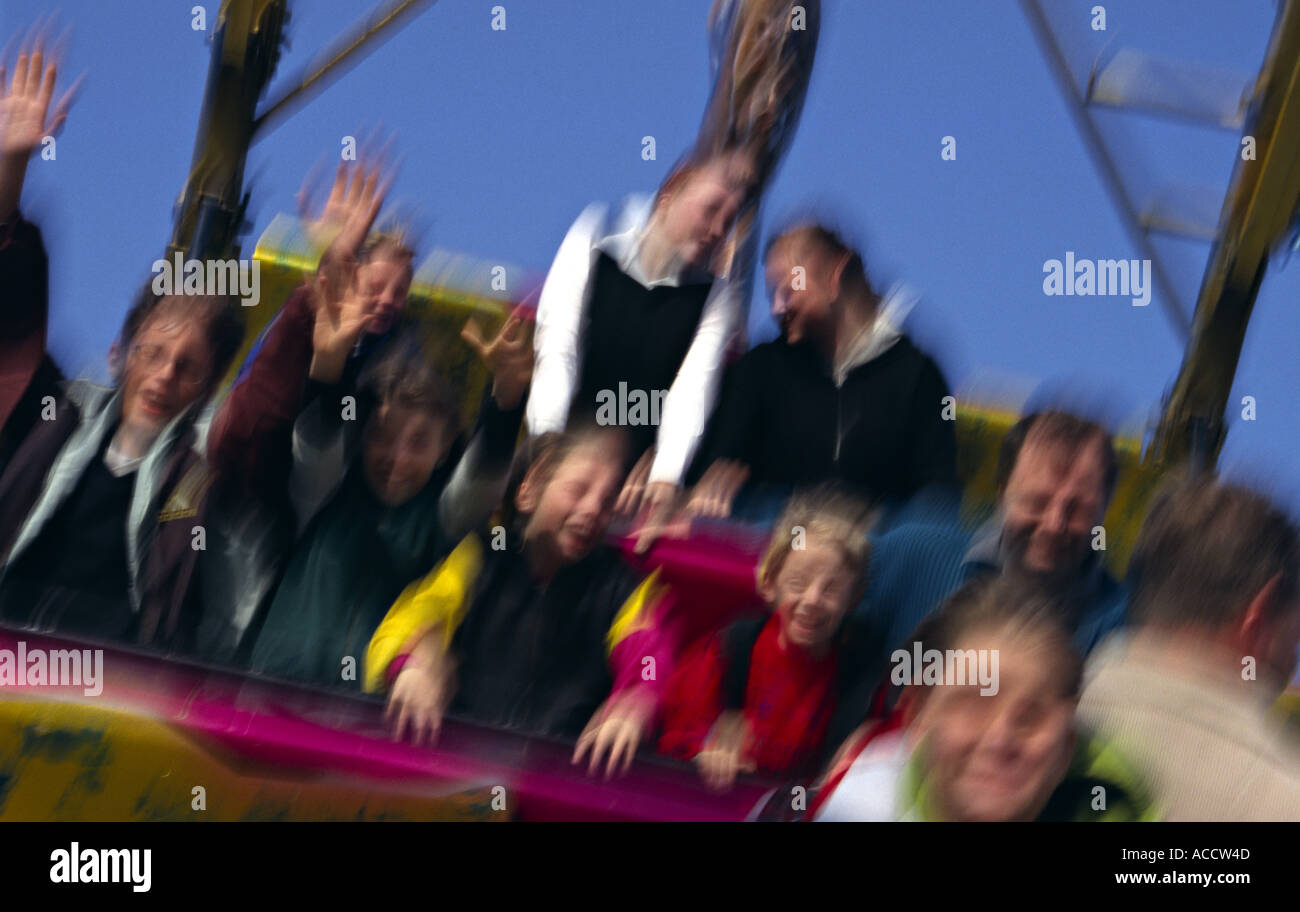 people roller coaster swing boat at amusement park Stock Photo - Alamy