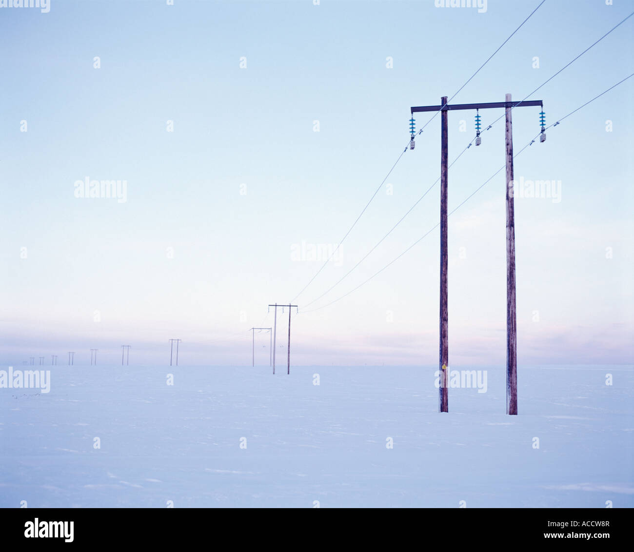 Power lines in a winter landscape Stock Photo - Alamy