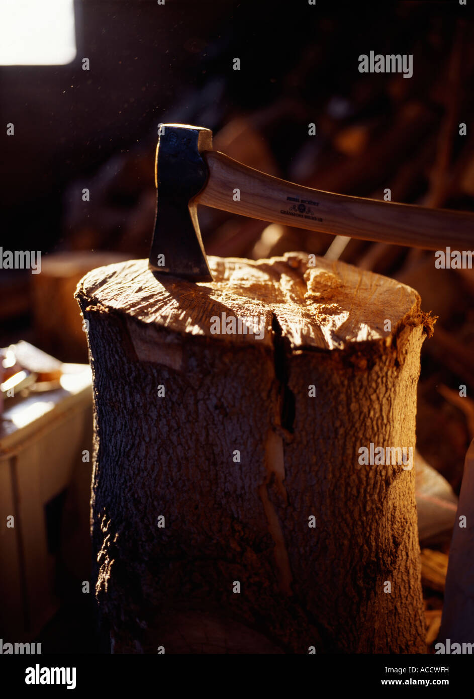 An ax on a chopping-block Stock Photo - Alamy
