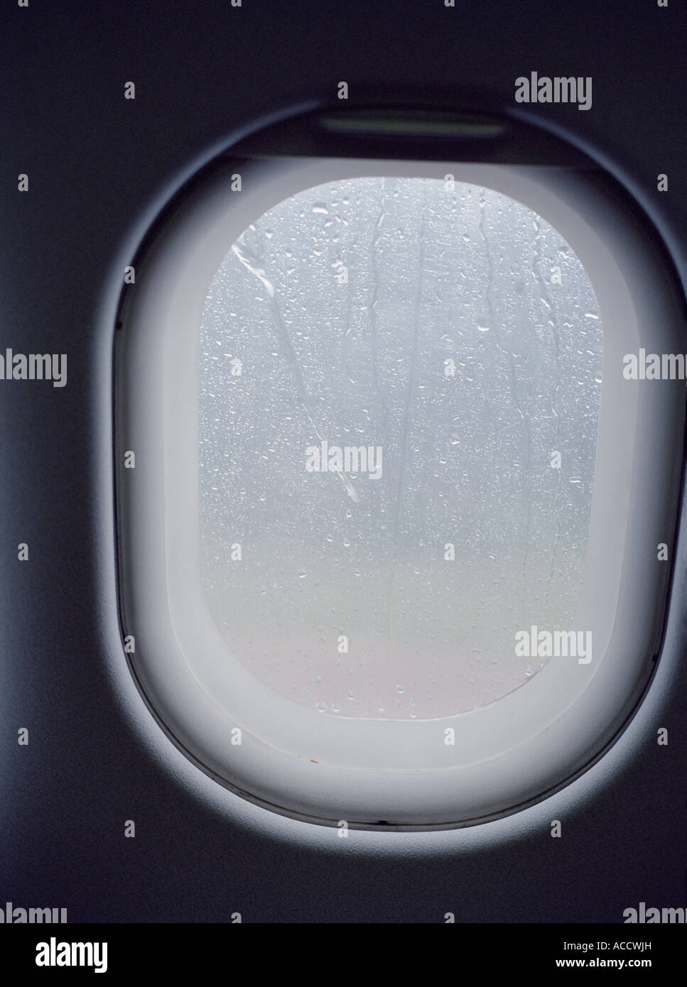 Rain on an airplane window Stock Photo - Alamy