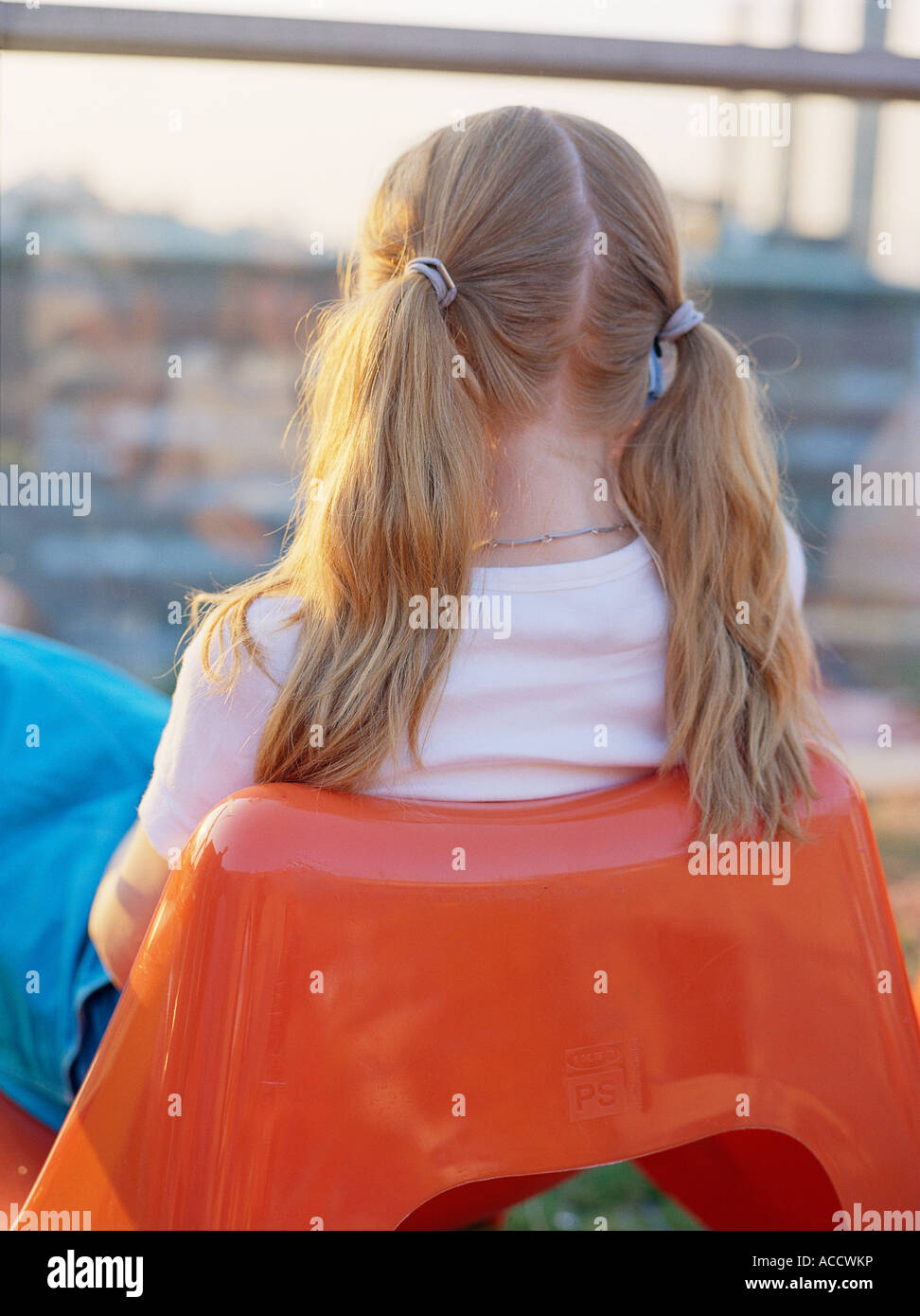 A woman with pony tails rear view Stock Photo - Alamy