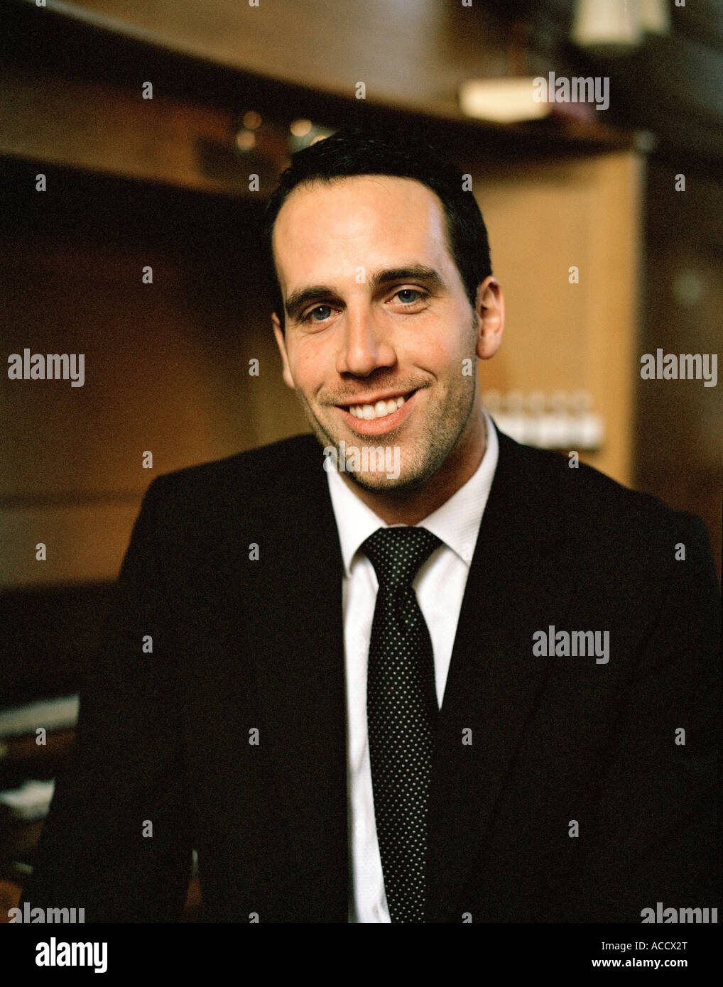 Portrait of a man sitting by an organ Stock Photo - Alamy