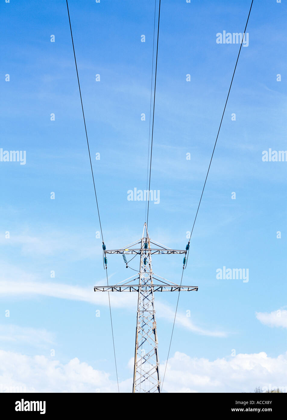 Power line against a blue sky Stock Photo - Alamy