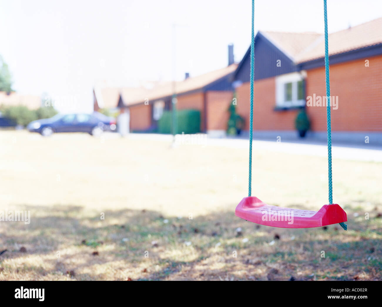 A swing on a playground Stock Photo - Alamy