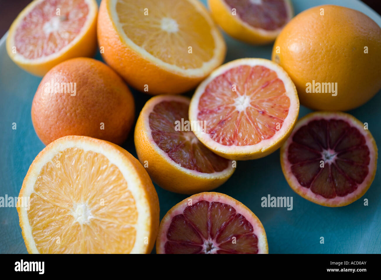 Citrus fruits on a blue background Stock Photo - Alamy