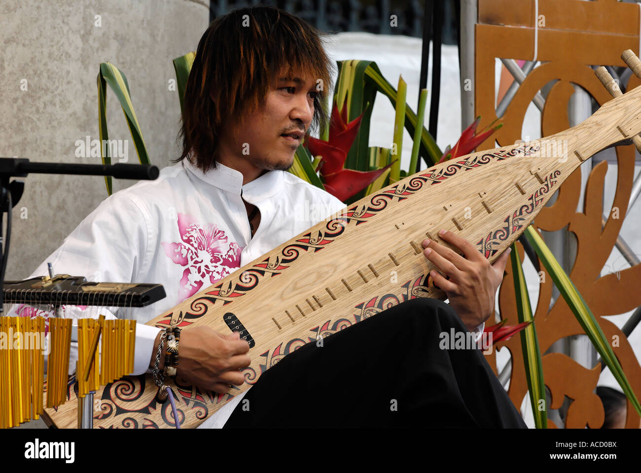 Sape player promoting visit Malaysia in London's Covent garden Stock ...