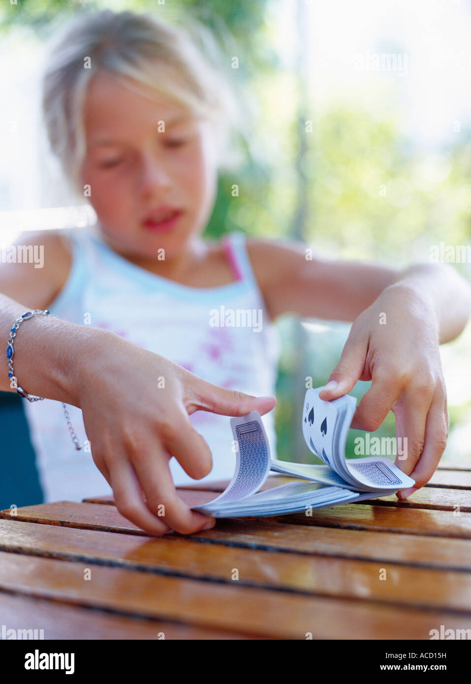 A girl playing card Stock Photo - Alamy