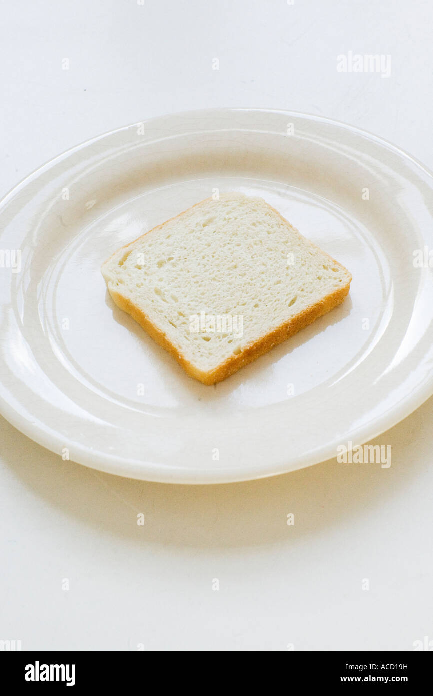 A piece of bred on a plate Stock Photo - Alamy