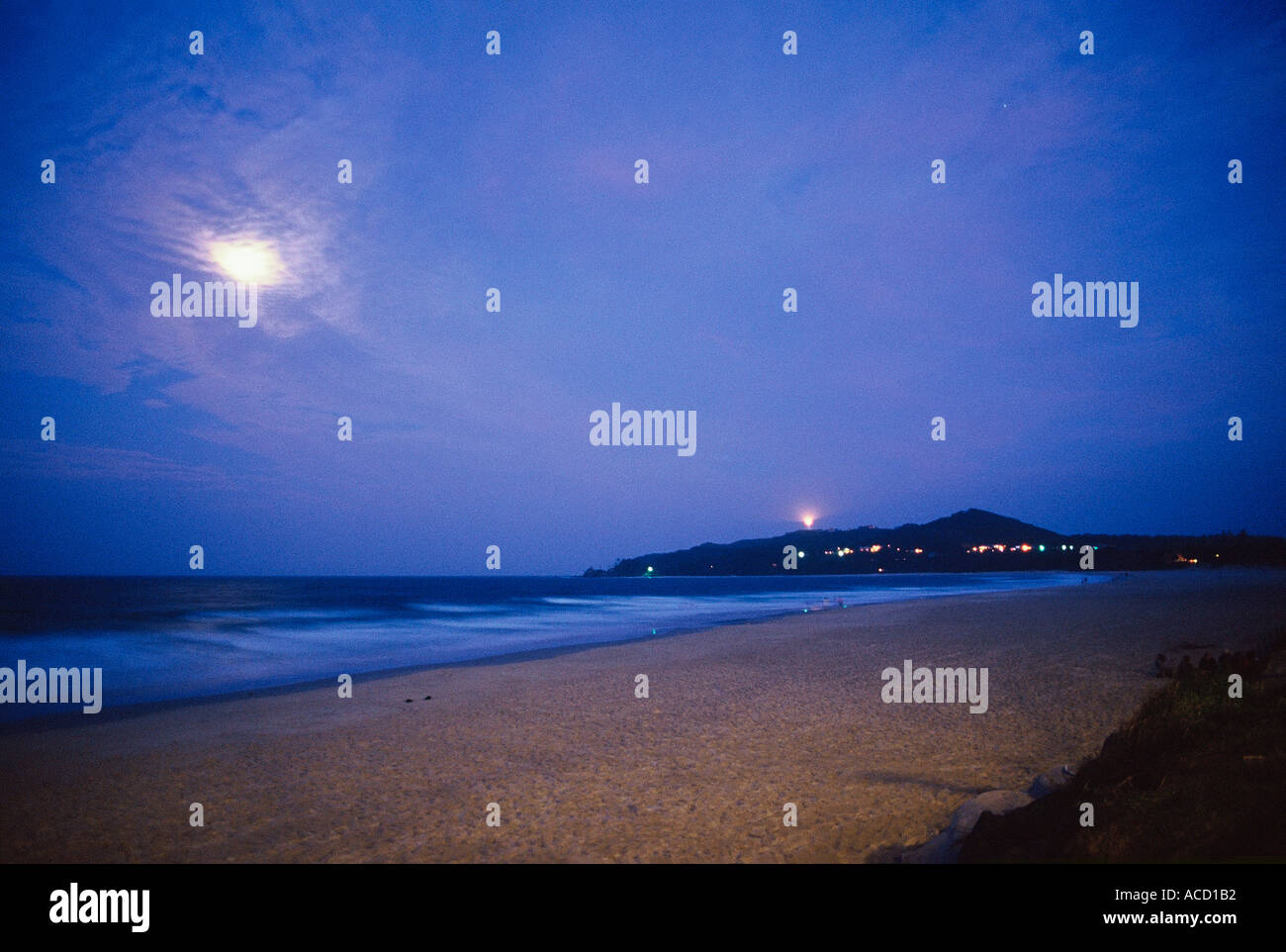 Byron Bay and moon behind soft clouds Stock Photo - Alamy