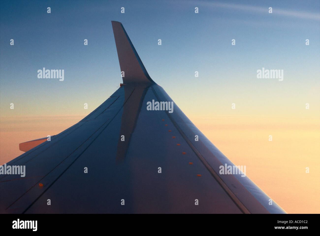 Wing of passenger plane during flight Stock Photo - Alamy