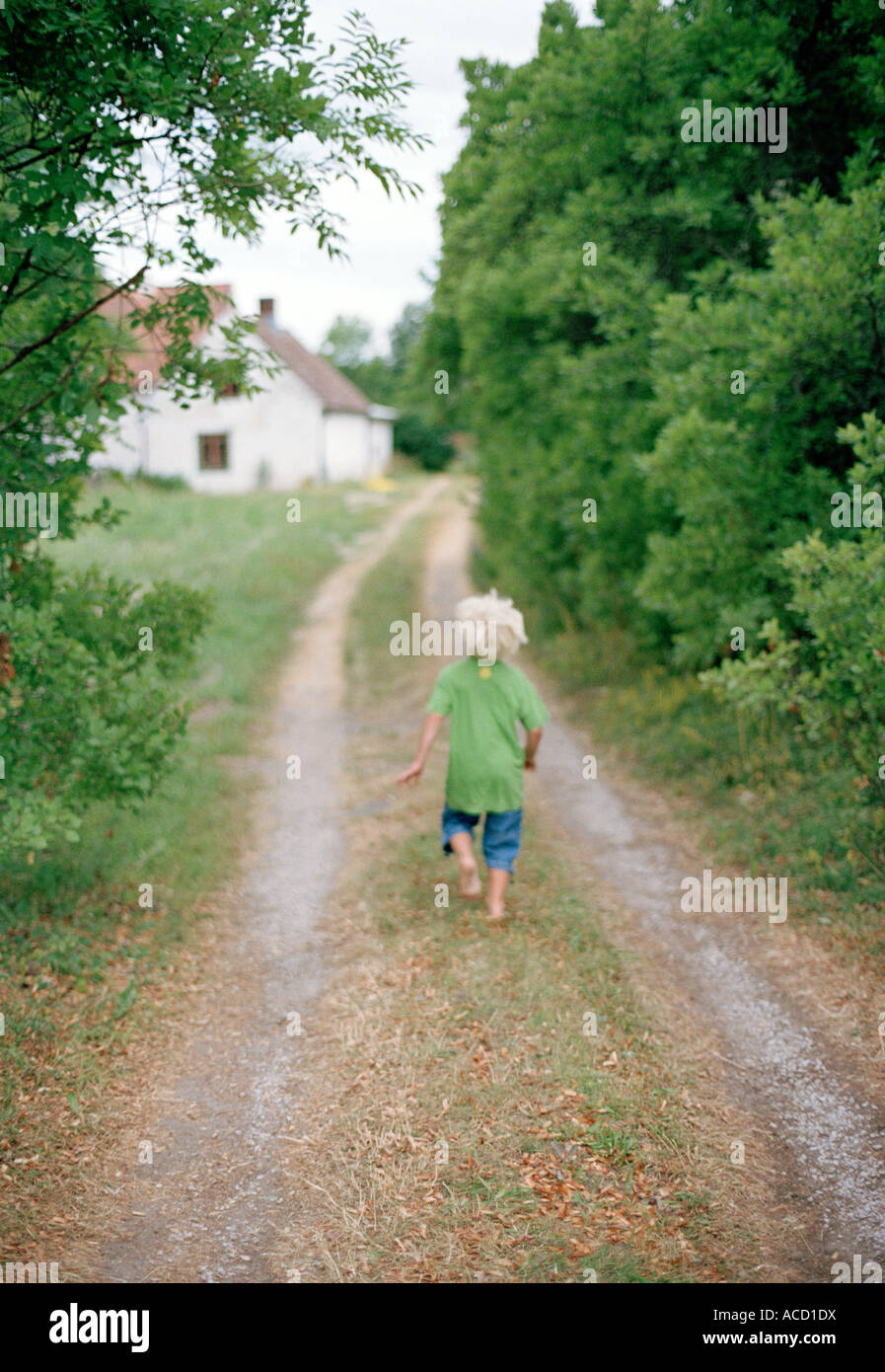 A boy running on a road Stock Photo - Alamy