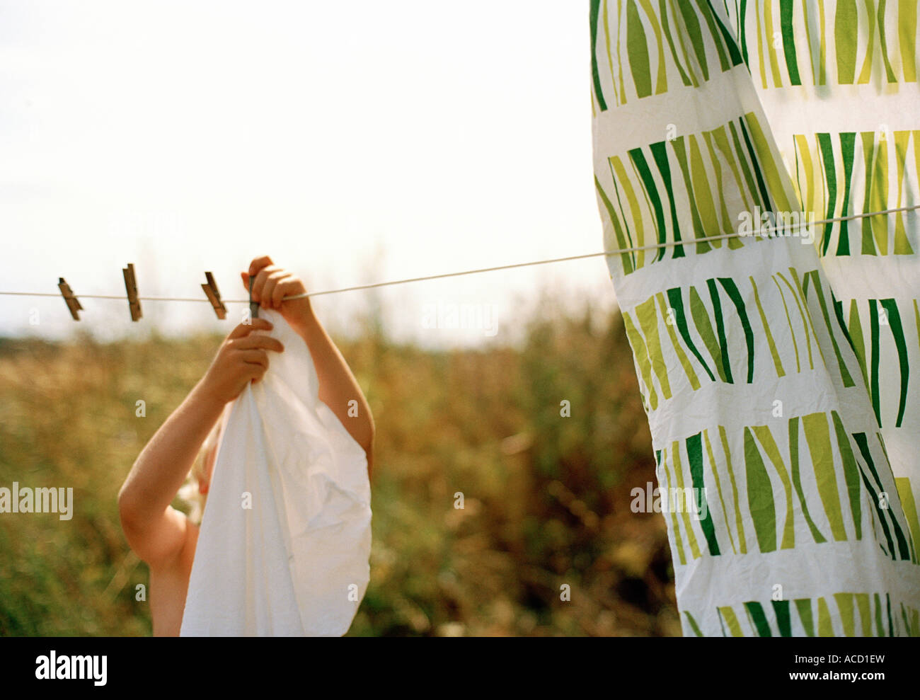 Child hanging laundry Stock Photo - Alamy