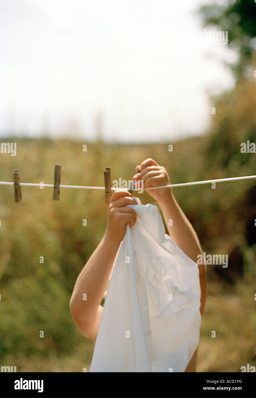 Child hanging laundry Stock Photo - Alamy