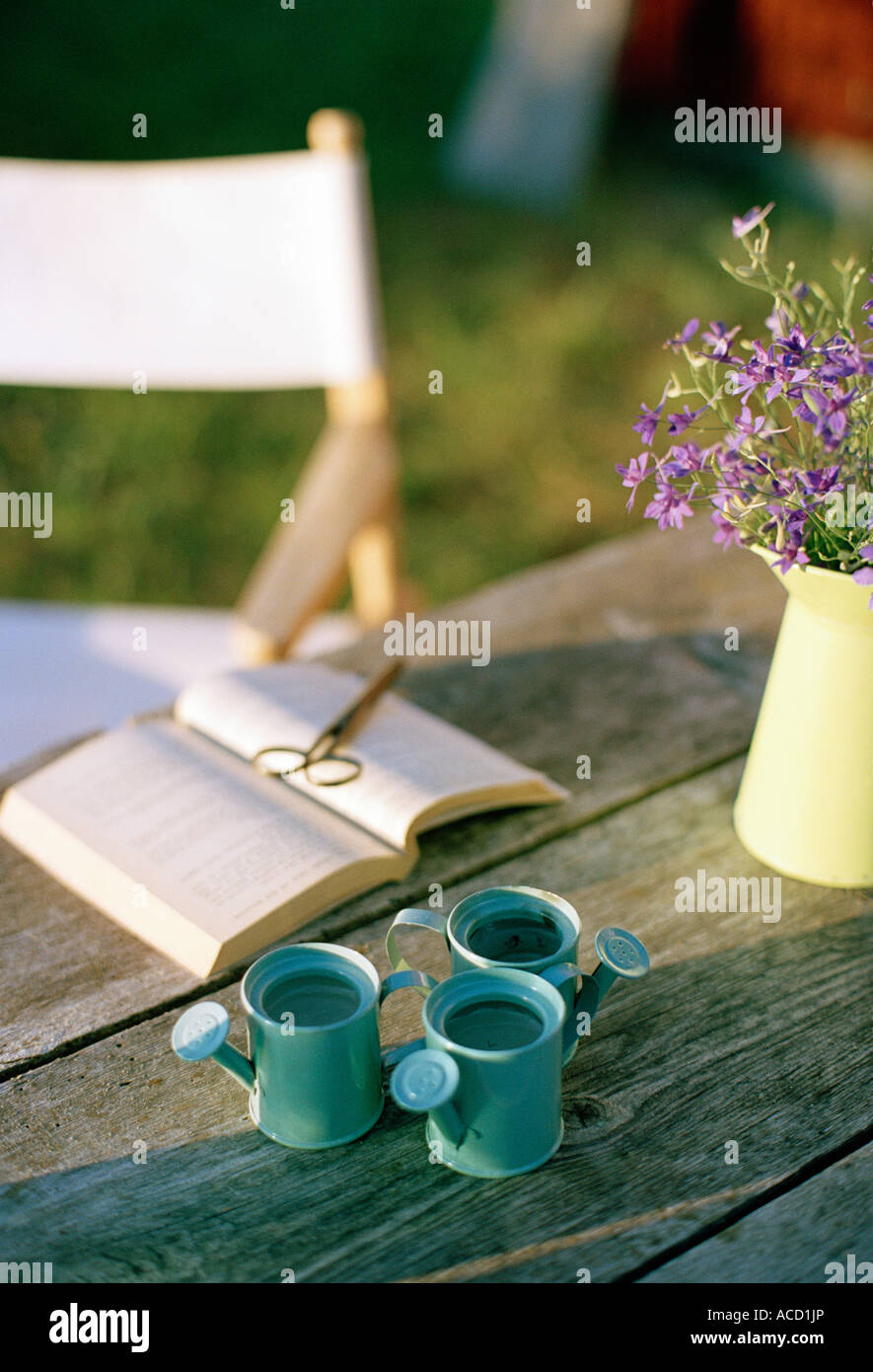 Candles on a garden table Stock Photo - Alamy