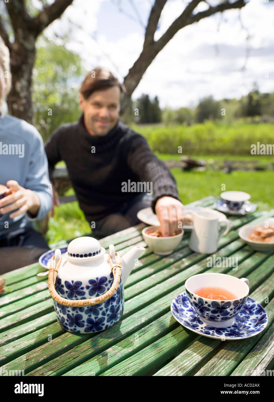Drinking tea in the garden Stock Photo - Alamy