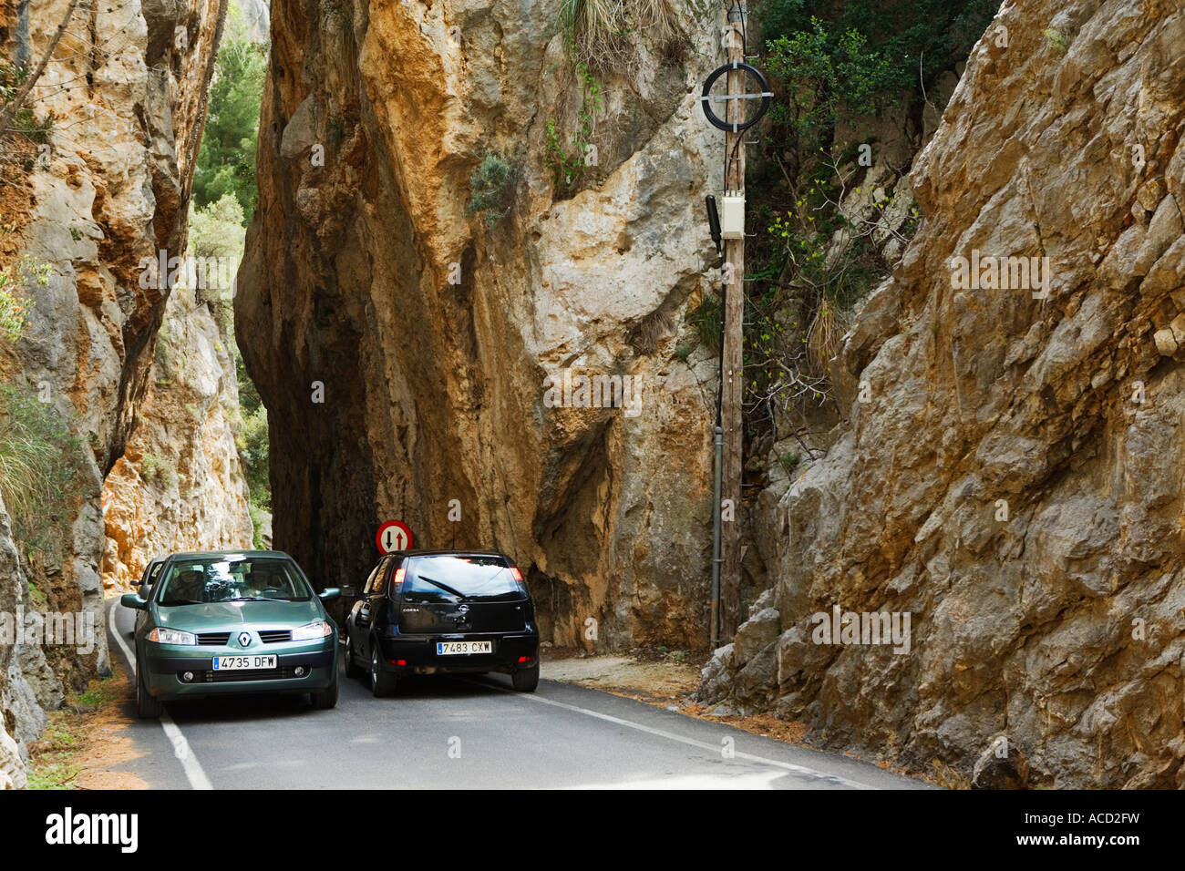 Cars meeting on a narrow road Stock Photo - Alamy