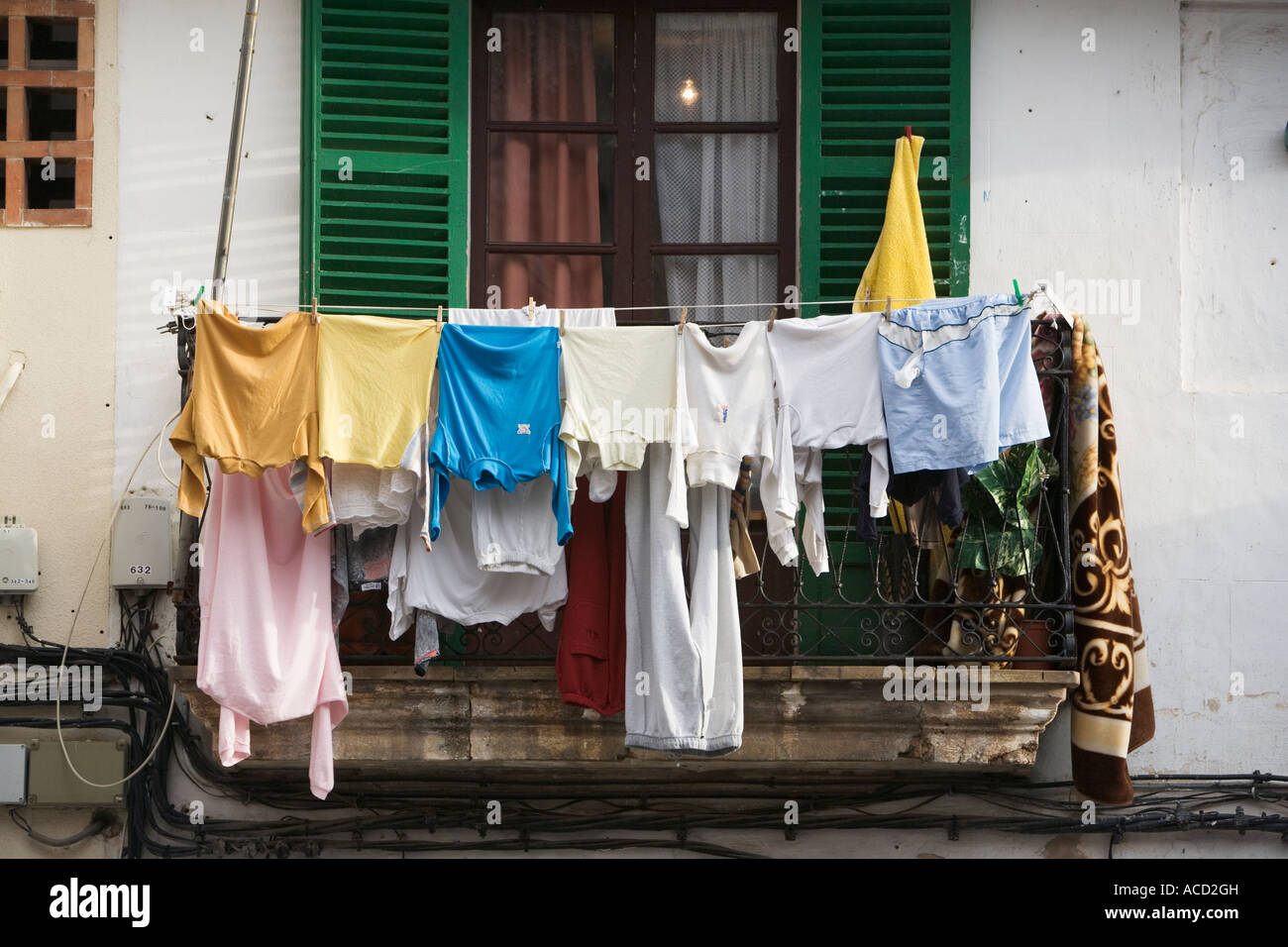 Clothes drying on a balcony Stock Photo - Alamy