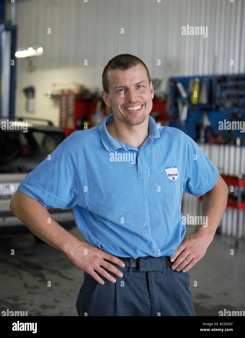 Portrait of a man in a garage Stock Photo - Alamy