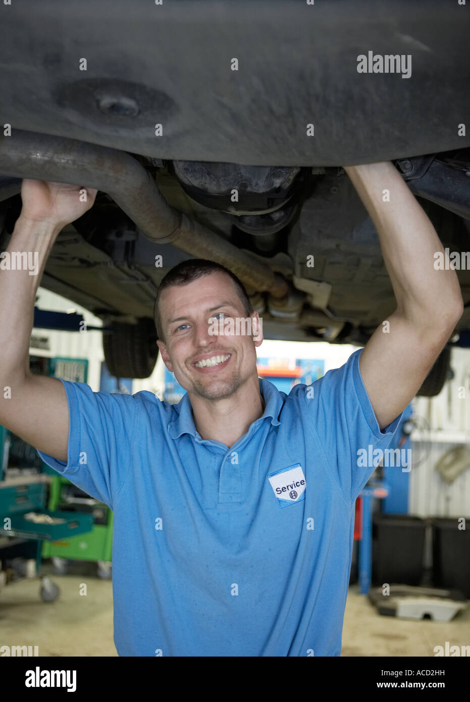 A man in a garage Stock Photo - Alamy