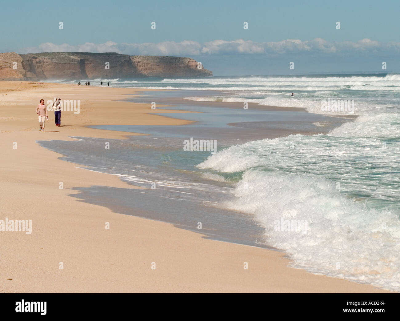 TWO PEOPLE WALKING ON WEST CAPE BEACH, INNES NATIONAL PARK, SOUTHERN ...