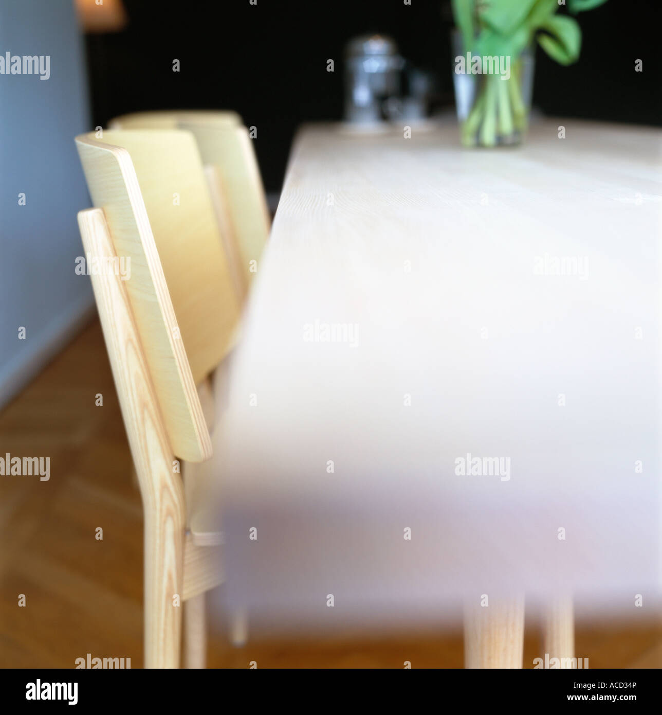 Chairs by a table Stock Photo - Alamy