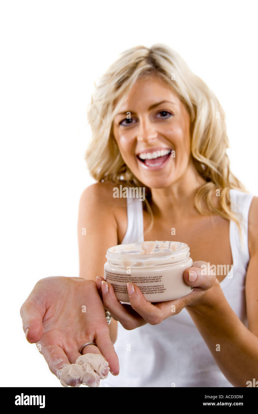 woman with a hand full of moisturising cream Stock Photo - Alamy