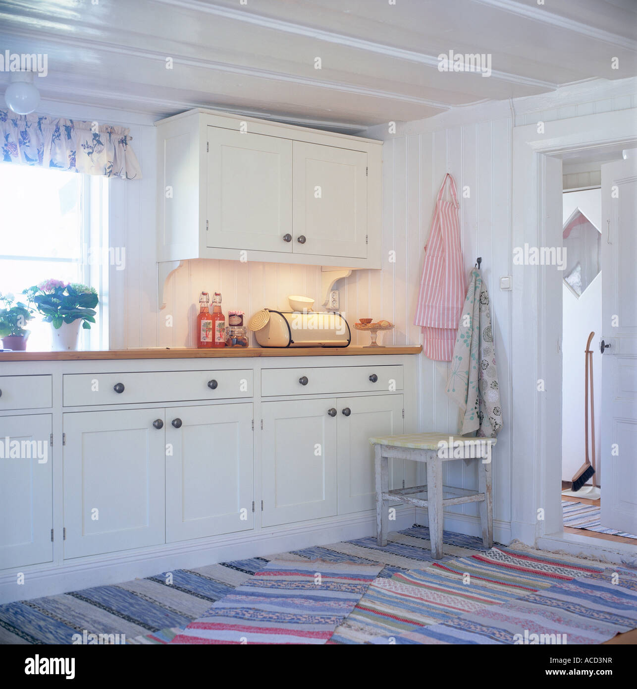 Kitchen with rag carpets Stock Photo - Alamy