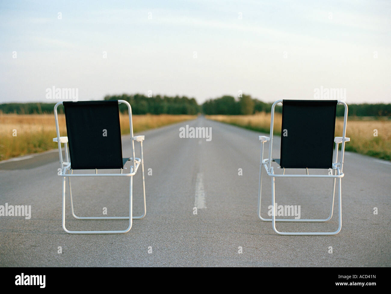 Two chairs on a road Stock Photo - Alamy