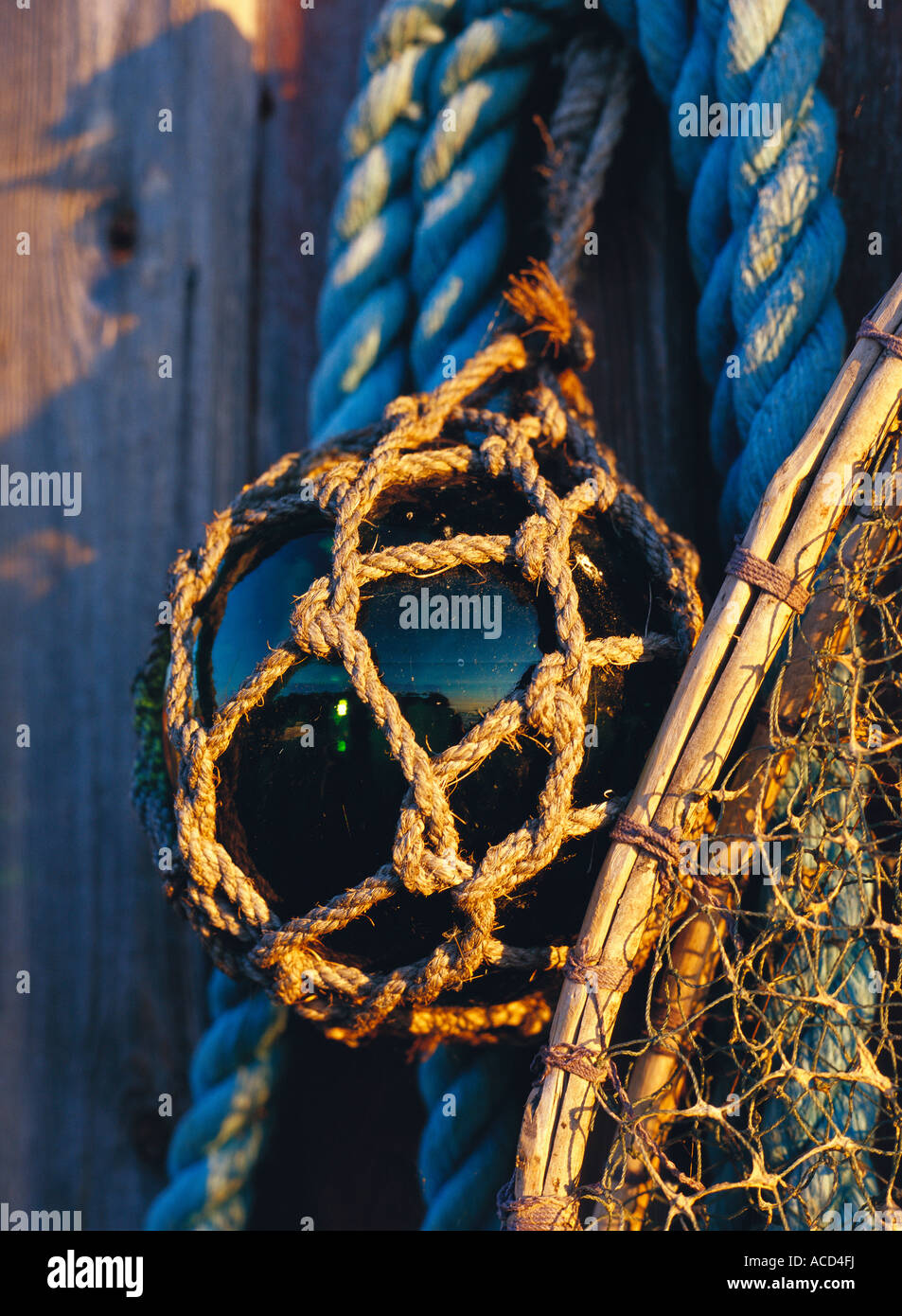 Rope and a float made of glass hanging on a wall Stock Photo - Alamy