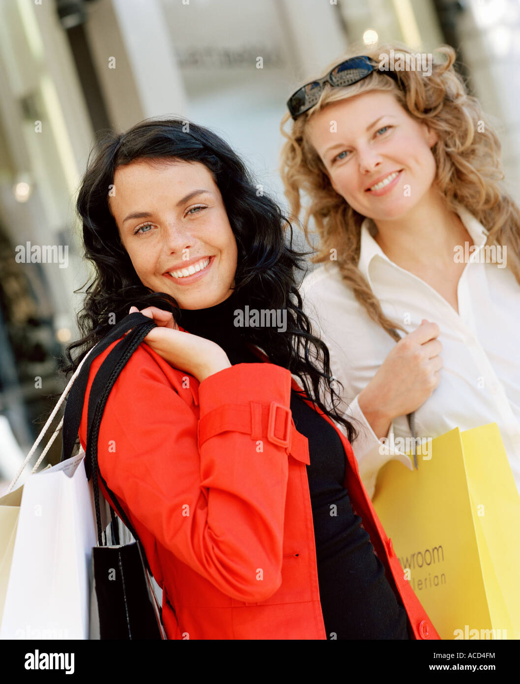 Two women shoppping Stock Photo - Alamy