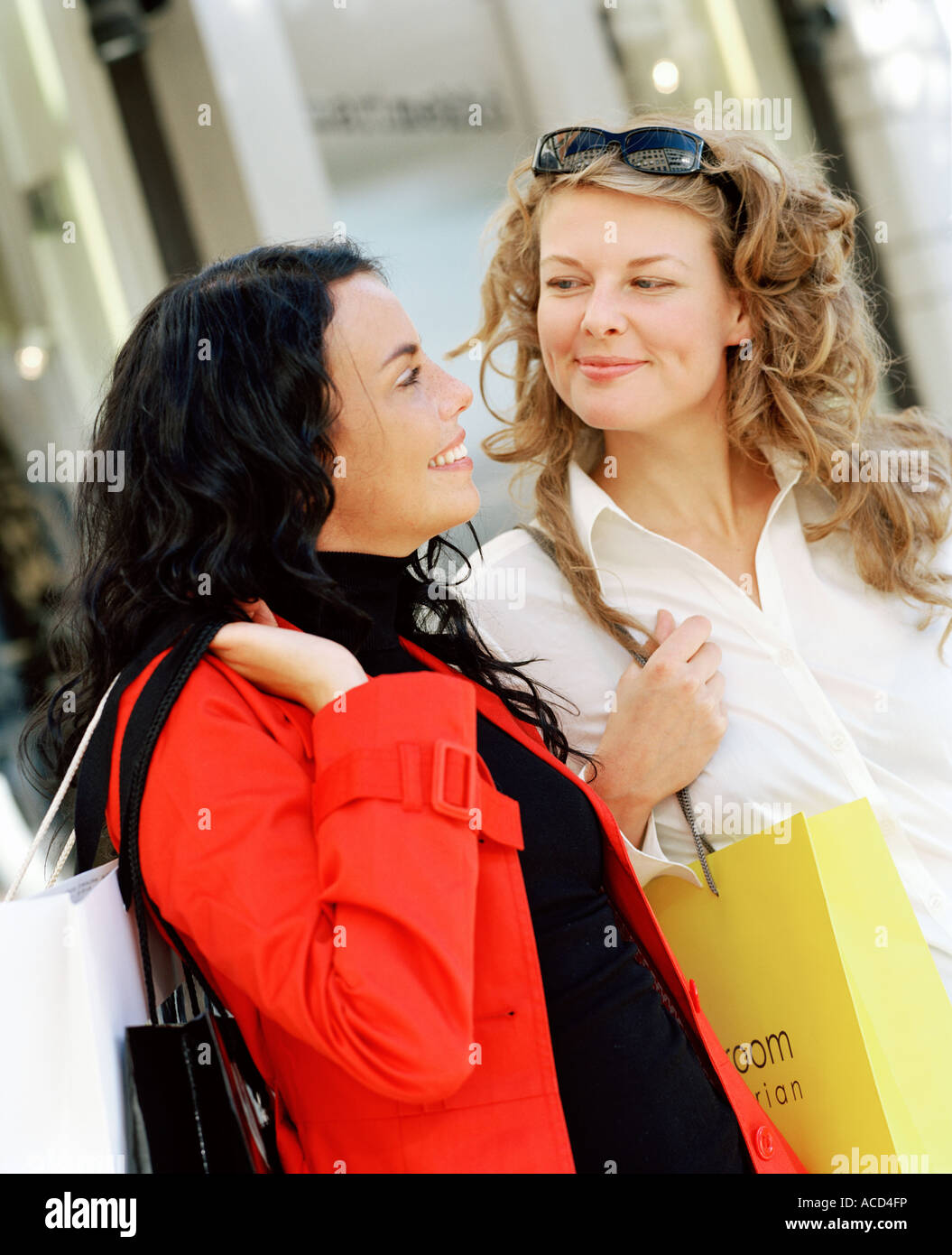Two women shopping Stock Photo - Alamy