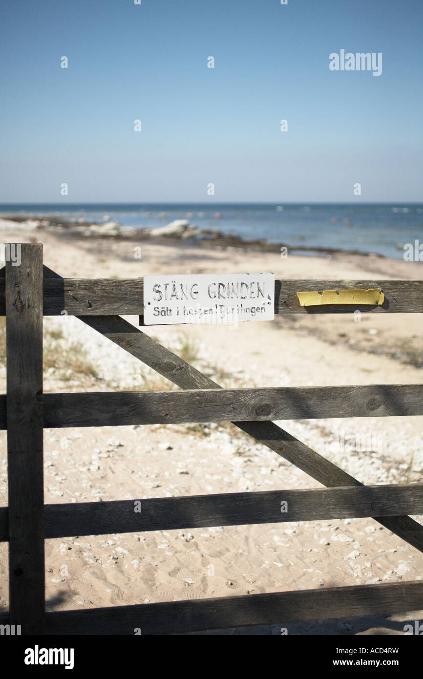 A closed gate on a beach Stock Photo - Alamy