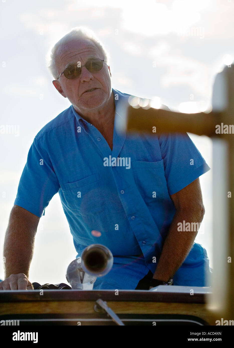 A man driving a boat Stock Photo - Alamy