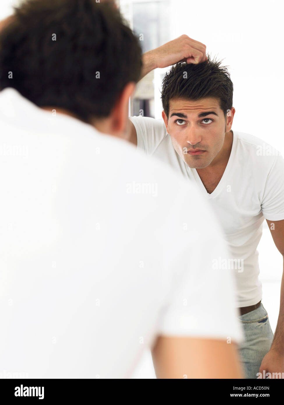 Fixing his hair hi-res stock photography and images - Alamy