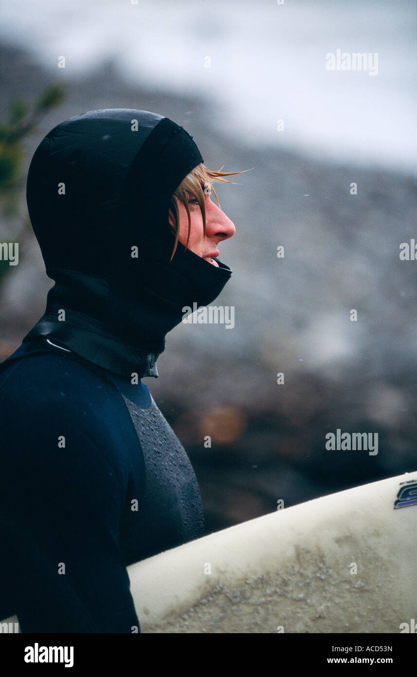 A surfer wearing wetsuit Stock Photo - Alamy