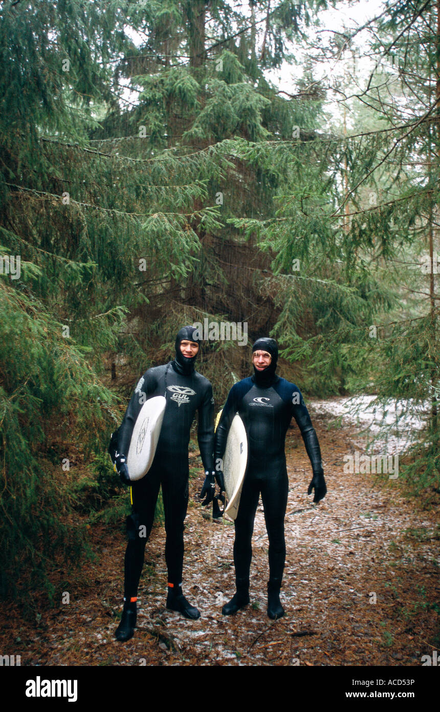 Two surfer in the forest Stock Photo - Alamy
