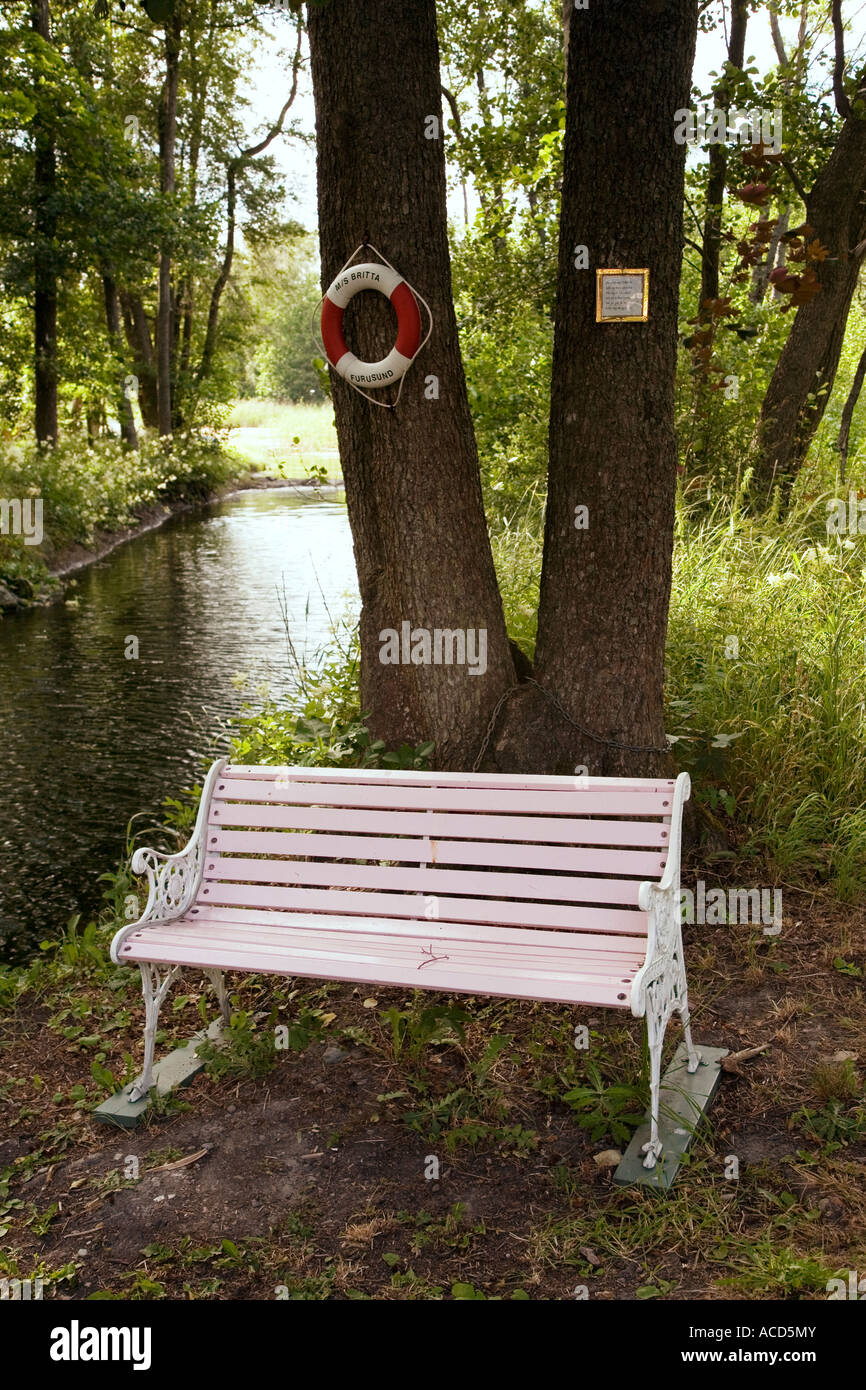 A Park bench at a stream Stock Photo - Alamy