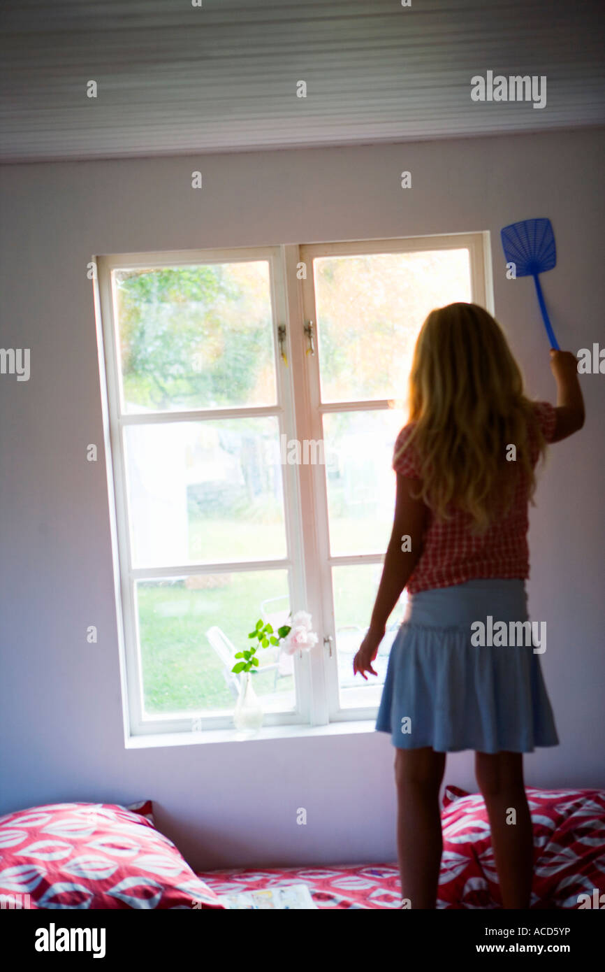 A girl hunting flies Stock Photo - Alamy