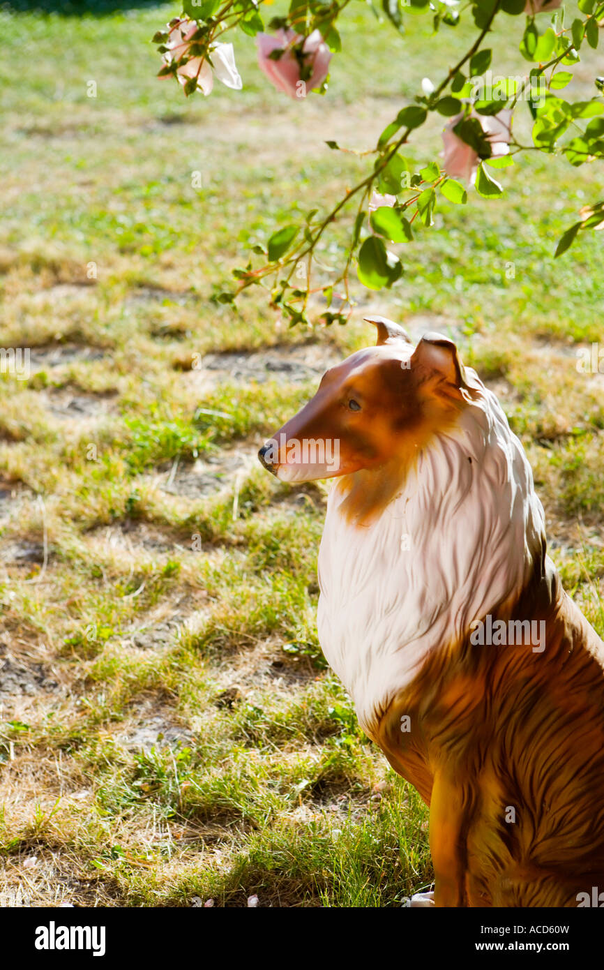 A plastic dog in a garden Stock Photo - Alamy
