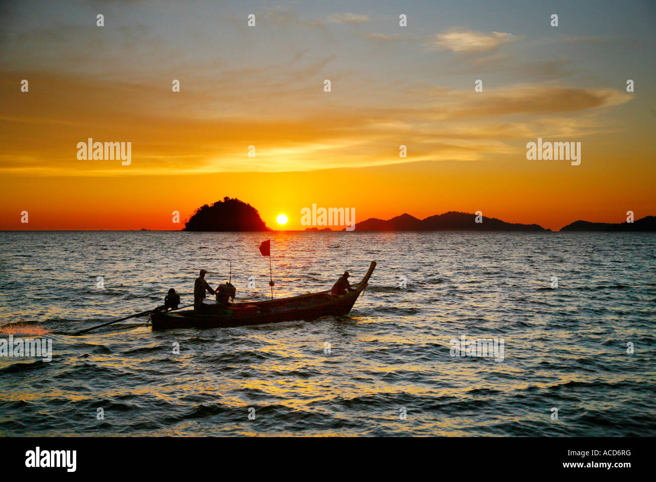 Sea Gypsy long-tailed boat at sunset off Ko (Koh) Adang, Andaman Sea ...