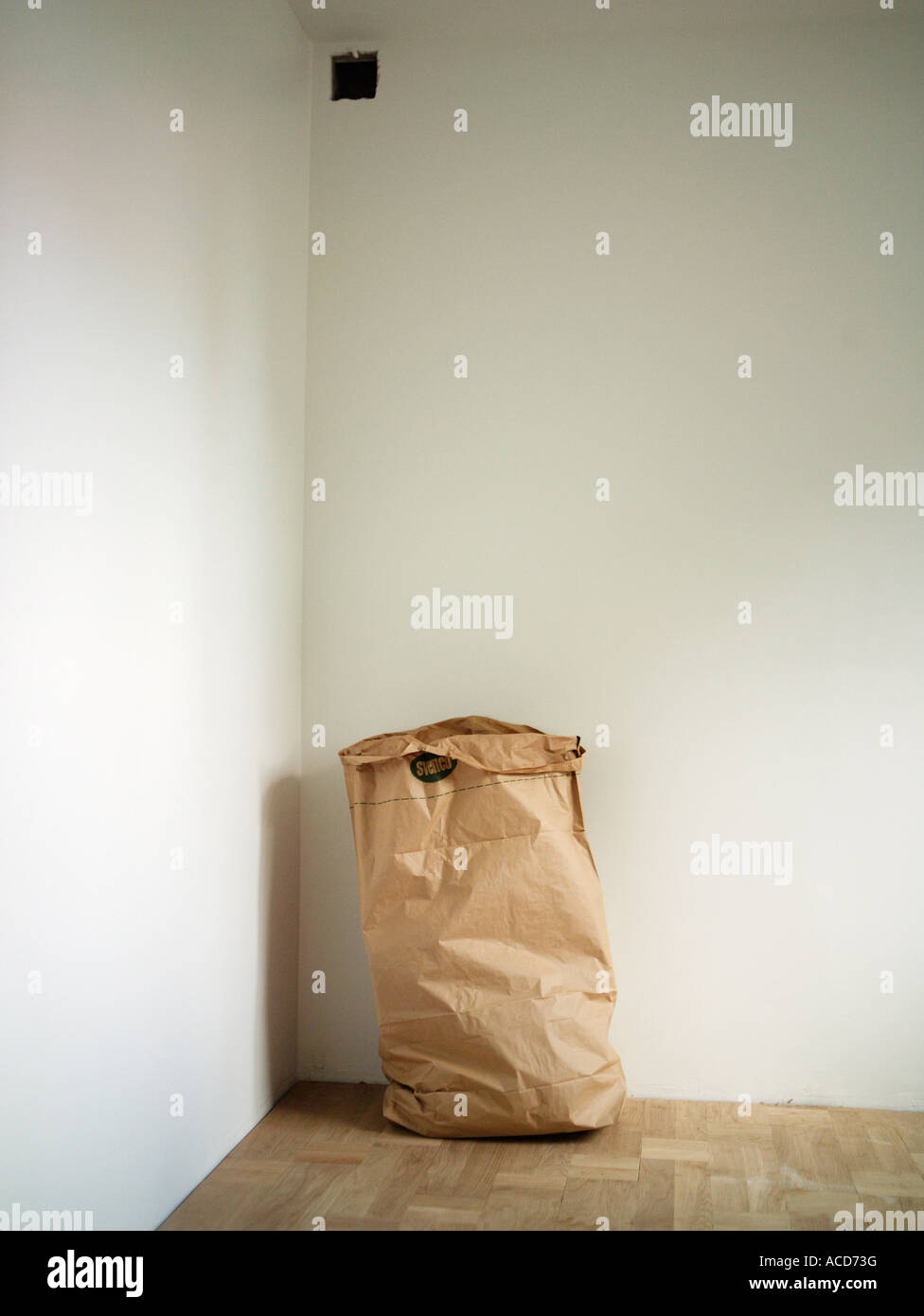A sack in an empty room Stock Photo - Alamy