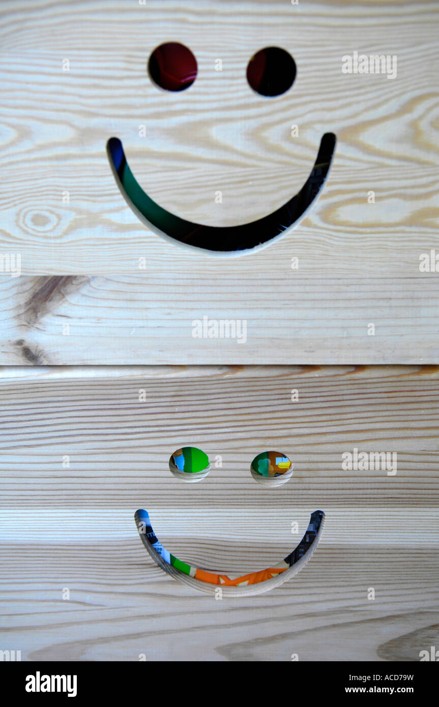 two smiley faces wood Stock Photo - Alamy