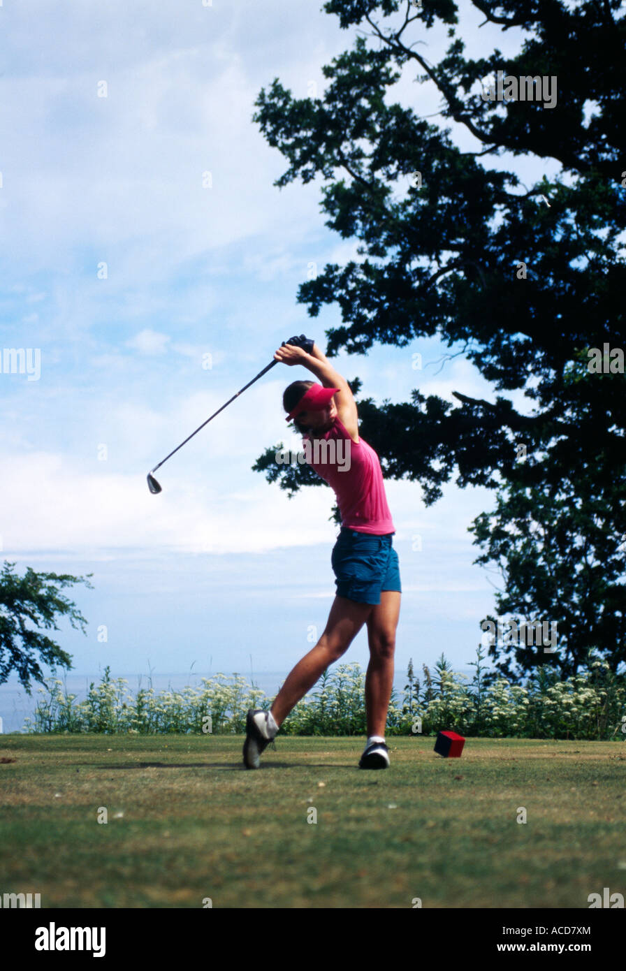 A woman playing golf Stock Photo - Alamy