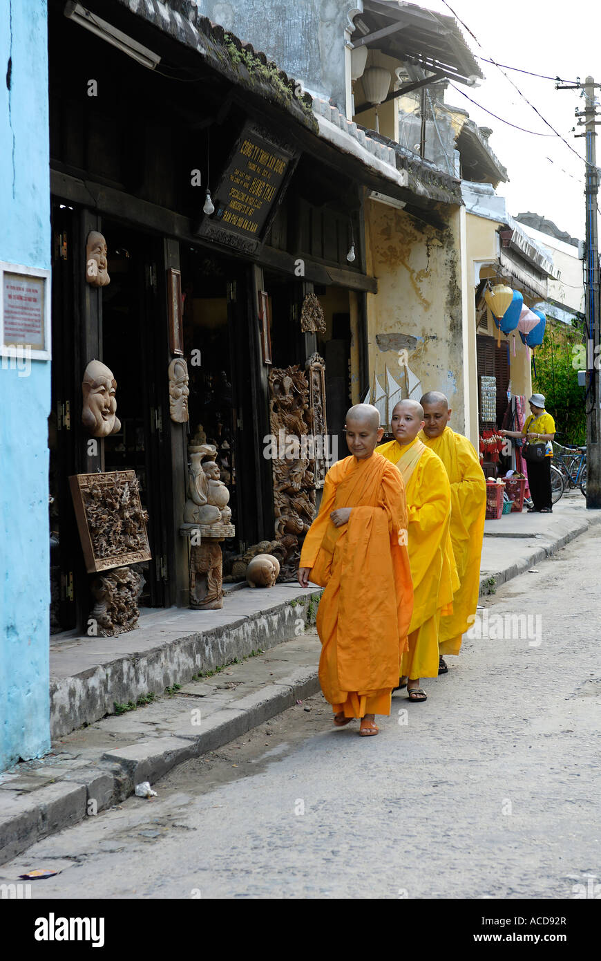 Three female monks in Hoi An Stock Photo - Alamy
